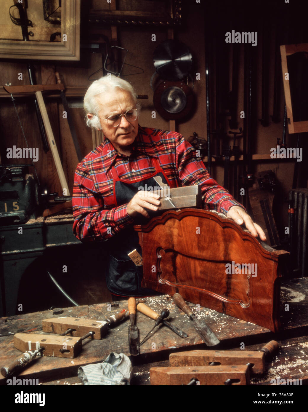 1980s SENIOR MAN PLAID SHIRT WOODWORKING WORKSHOP USING TOOL Stock ...