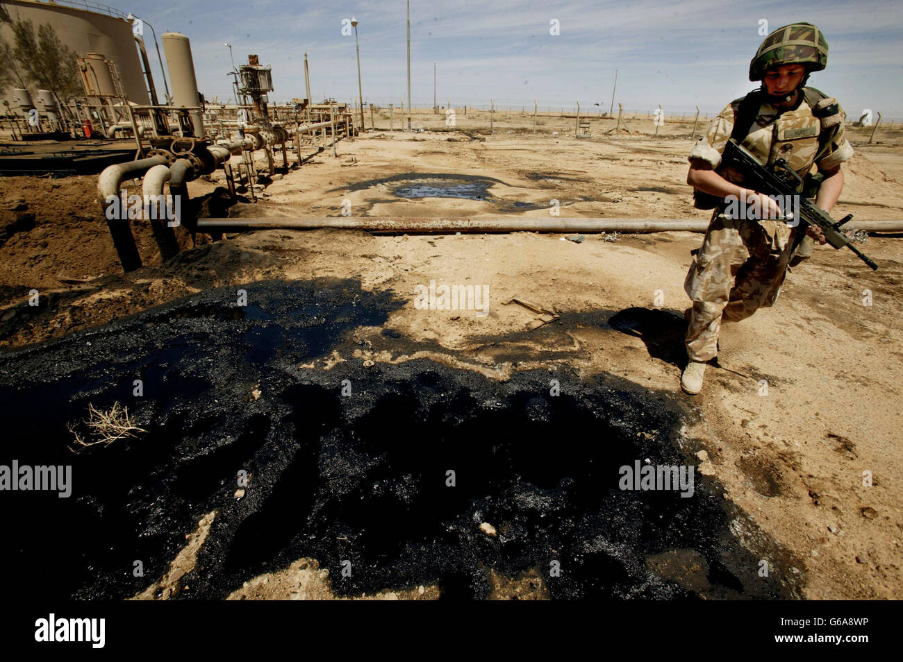 Troop patrols oil plant Stock Photo - Alamy