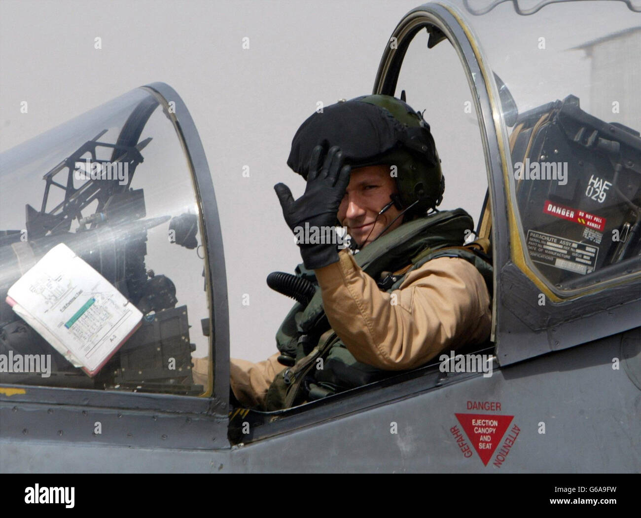 British Royal Air Force Harrier GR7 pilot Flt Lt Pete Keenlyside waves ...