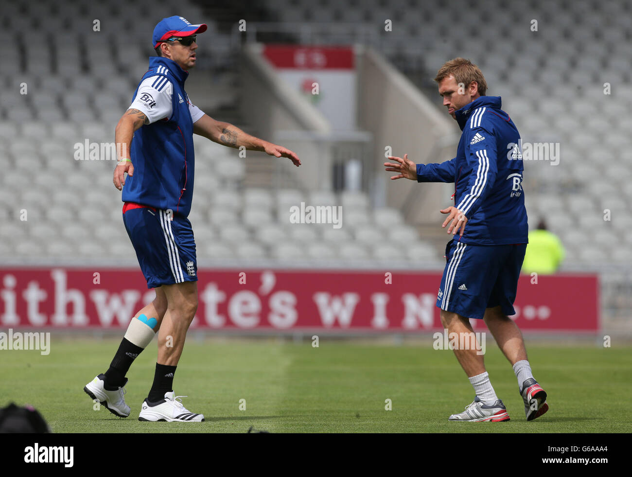 England batsman Kevin Pietersen (left) warms up with phyiso Craig De ...