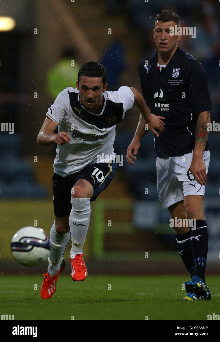 Rangers Nicky Clark holds off Dundee's Ian Davidson during the Pre ...