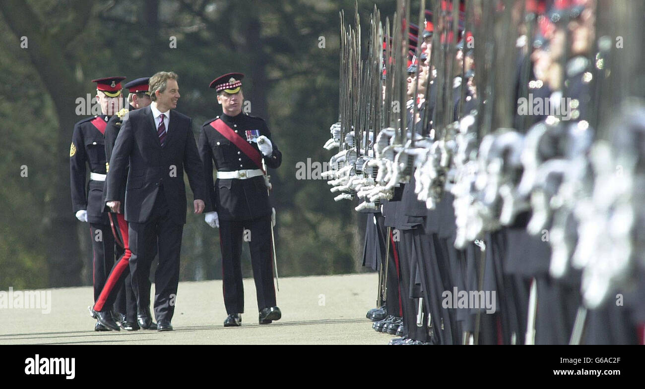 Prime Minister Tony Blair inspects officer cadets passing out of the Army's top training college ...
