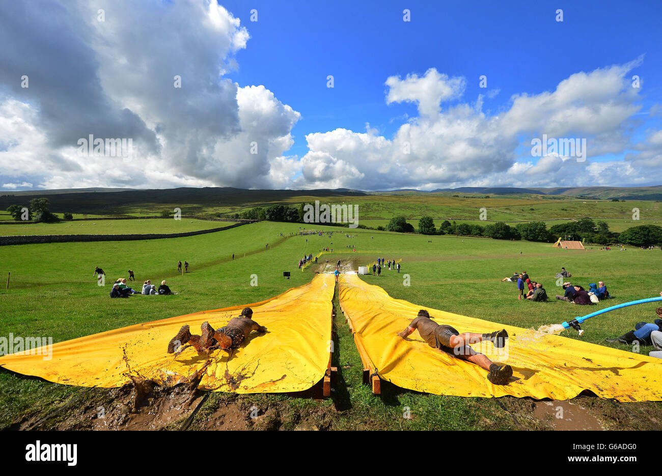 Competitors on the 'Slide Away' section of the Total Warrior 10 Mile ...