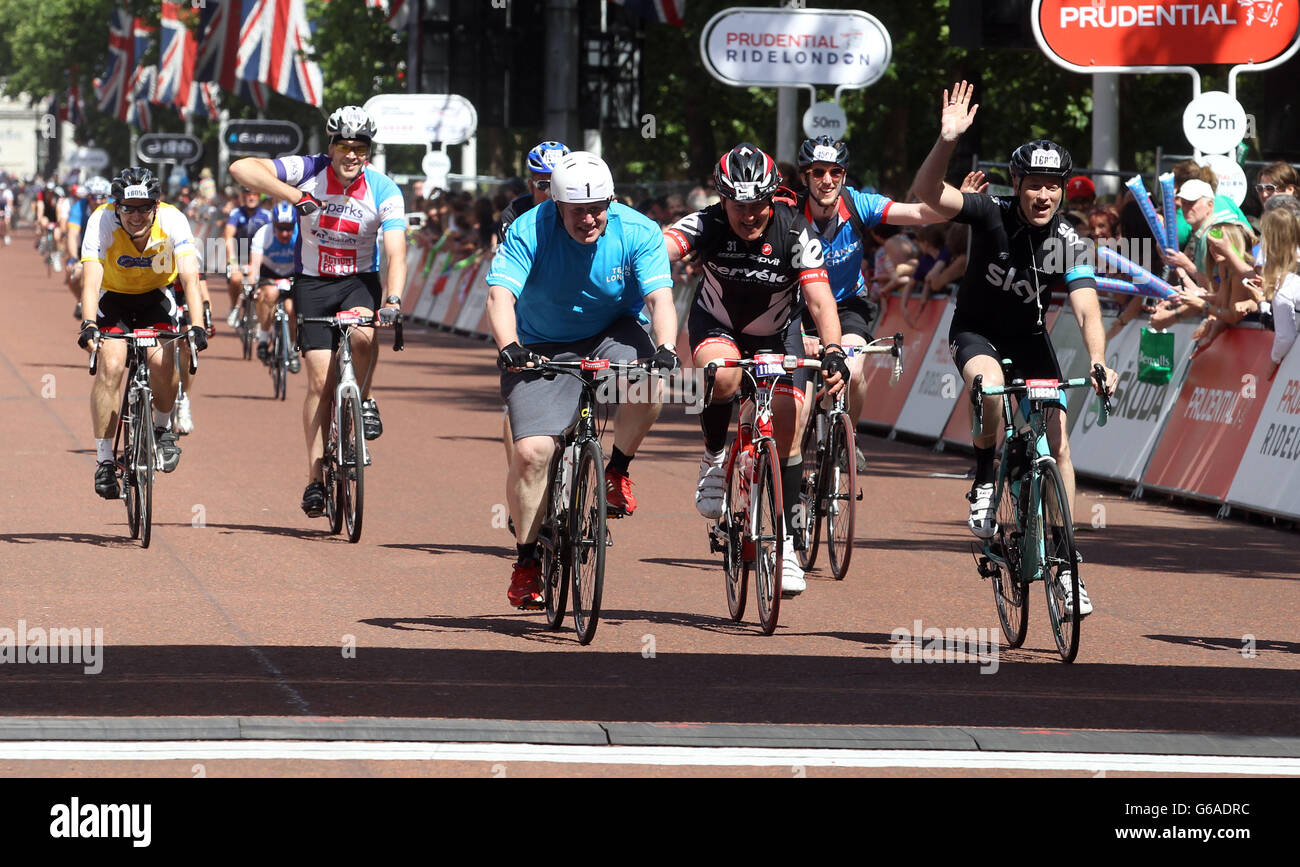 London Mayor Boris Johnson completes the Surrey 100 mile bike ride ...