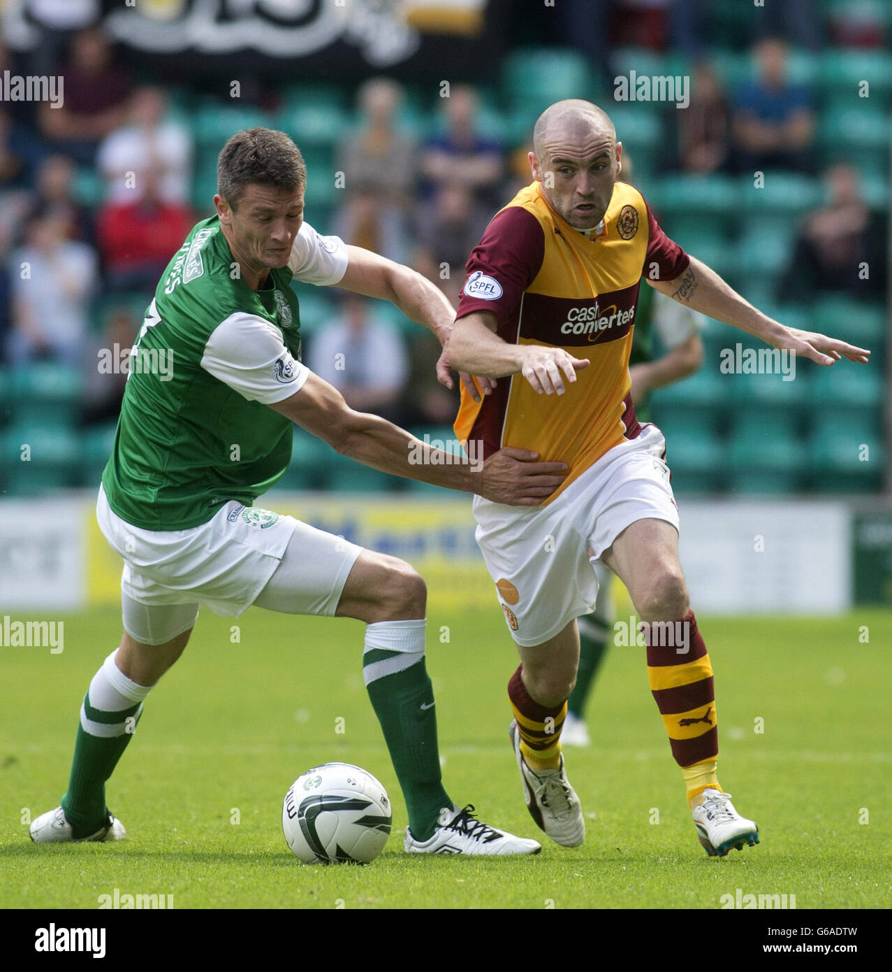 Hibernian's Alex Harris and Motherwell's James McFadden (right) in ...