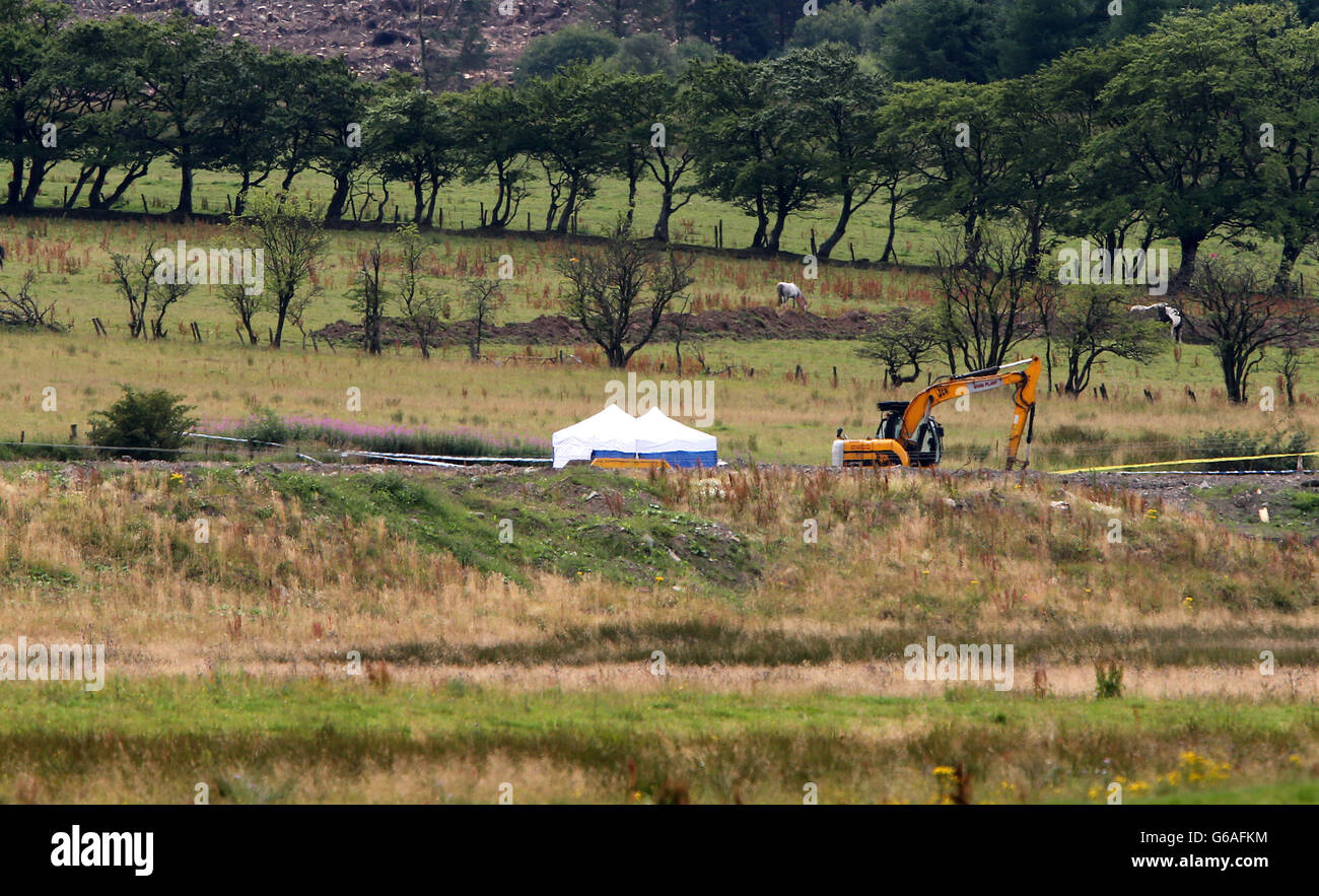 Previously unreleased photo dated 6/8/2013 of a police forensic tent at ...