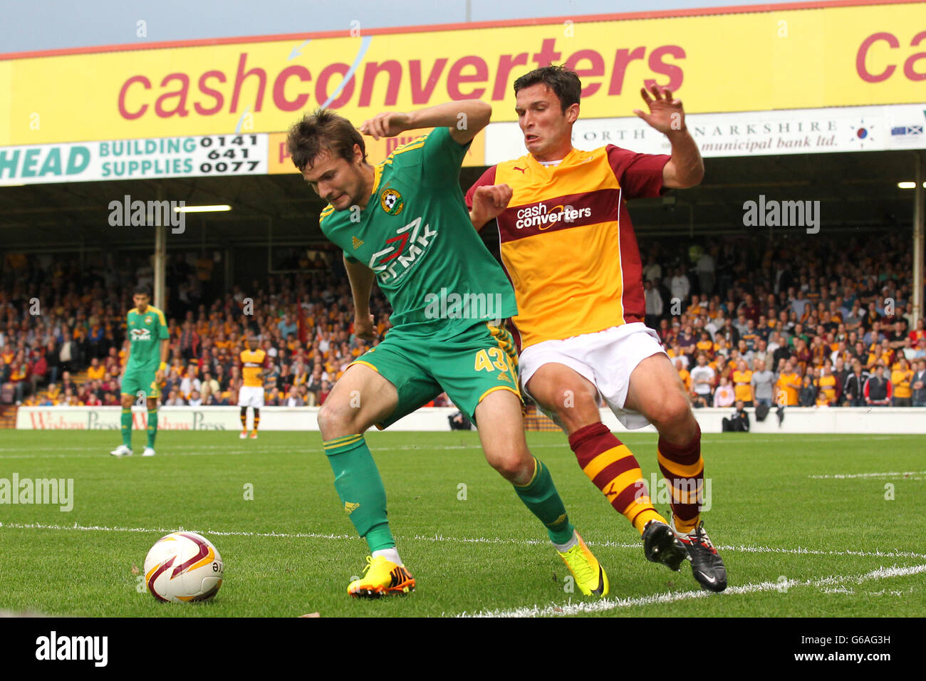 Kuban Krasnodar's Roman Bugaev (left) wins the ball ahead of Motherwell ...