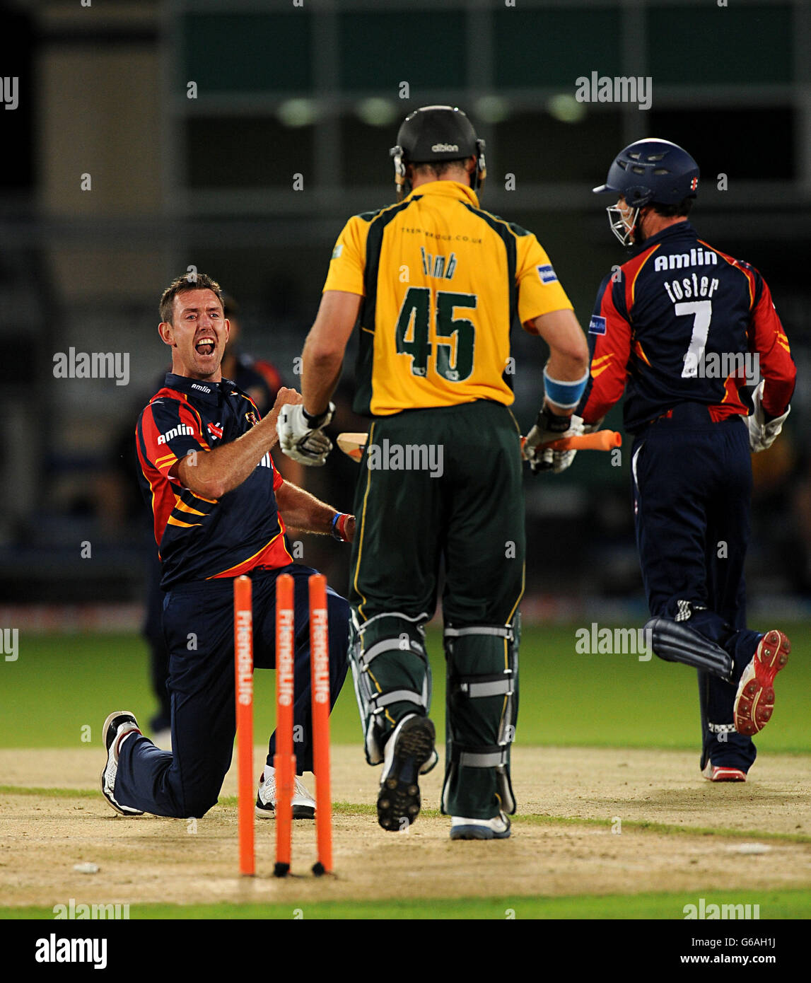 Essex's David Masters (left) celebrates taking the wicket of ...
