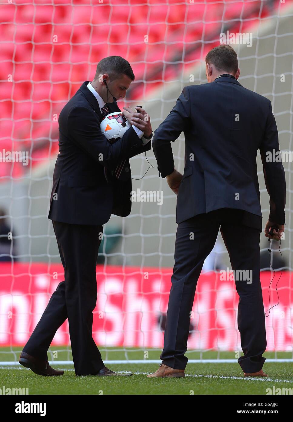 Fourth Official Michael Oliver (left) tests the goal line technology on ...