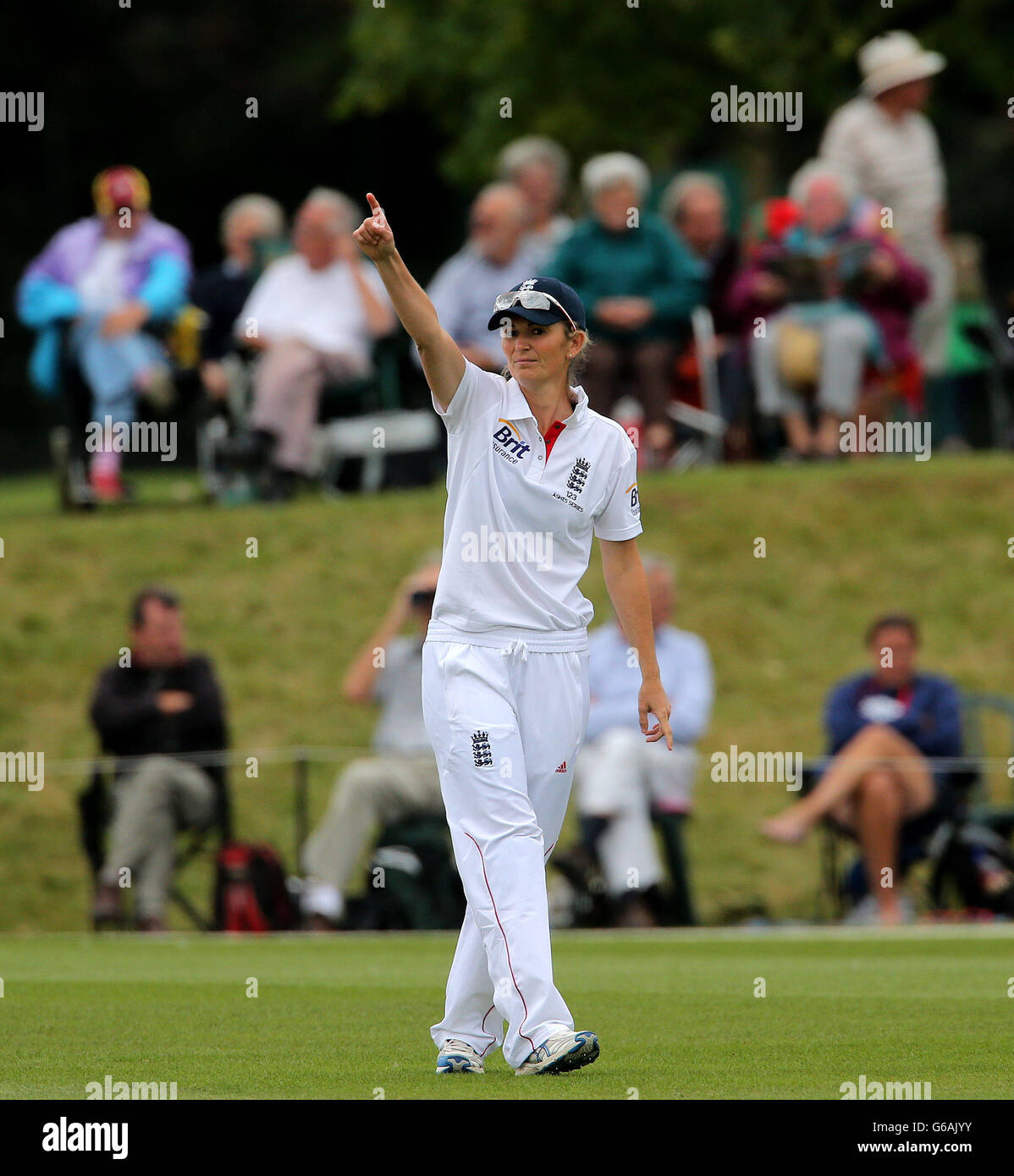 England captain Charlotte Edwards (right) directs the field during day ...
