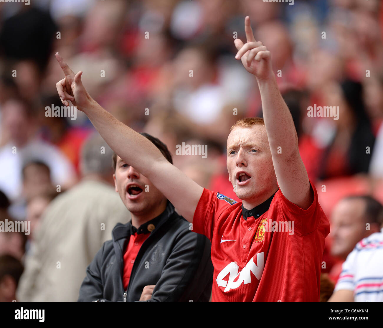 Manchester united fan shows support for his team in the hi-res stock ...