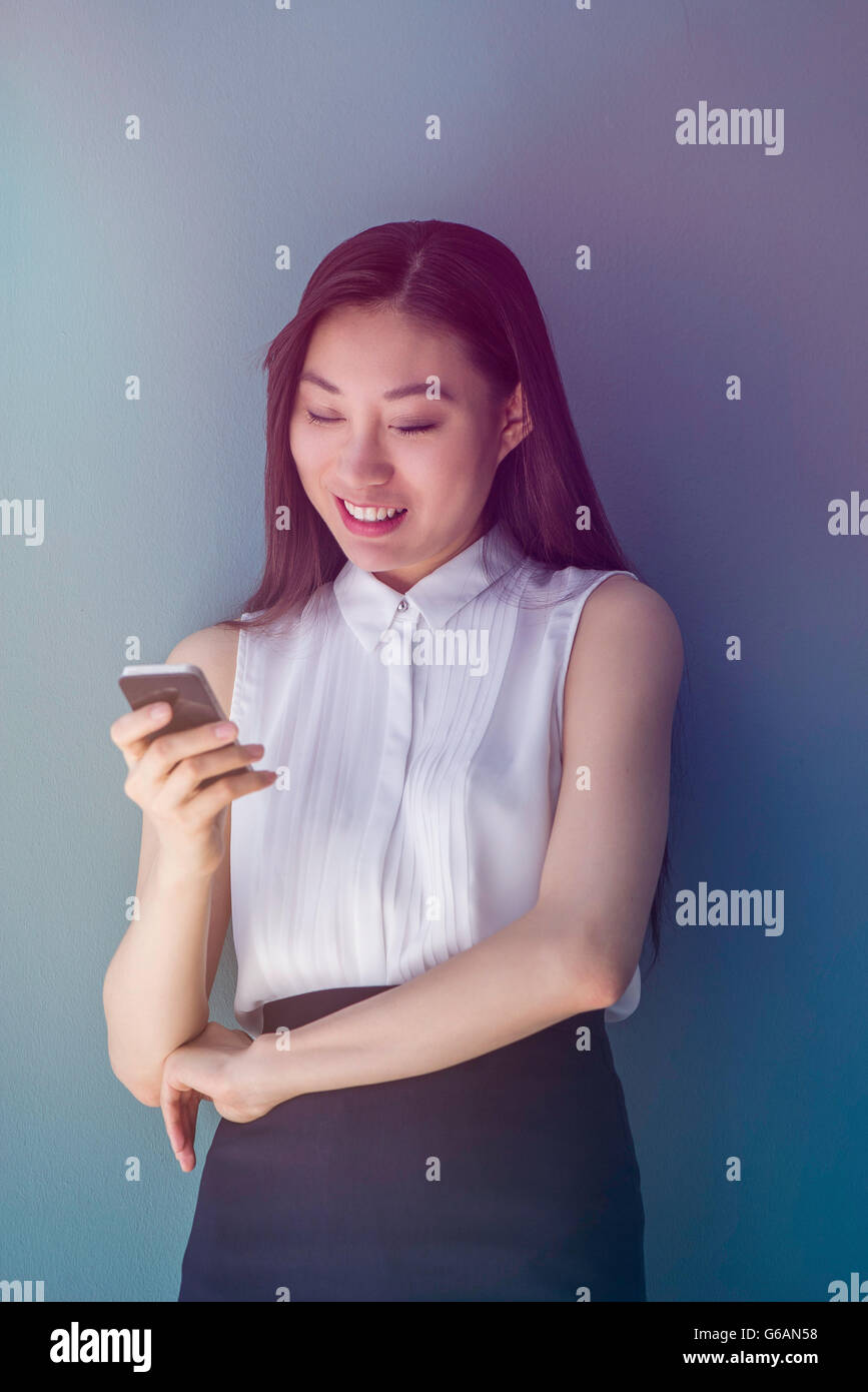 Woman using smartphone Stock Photo - Alamy