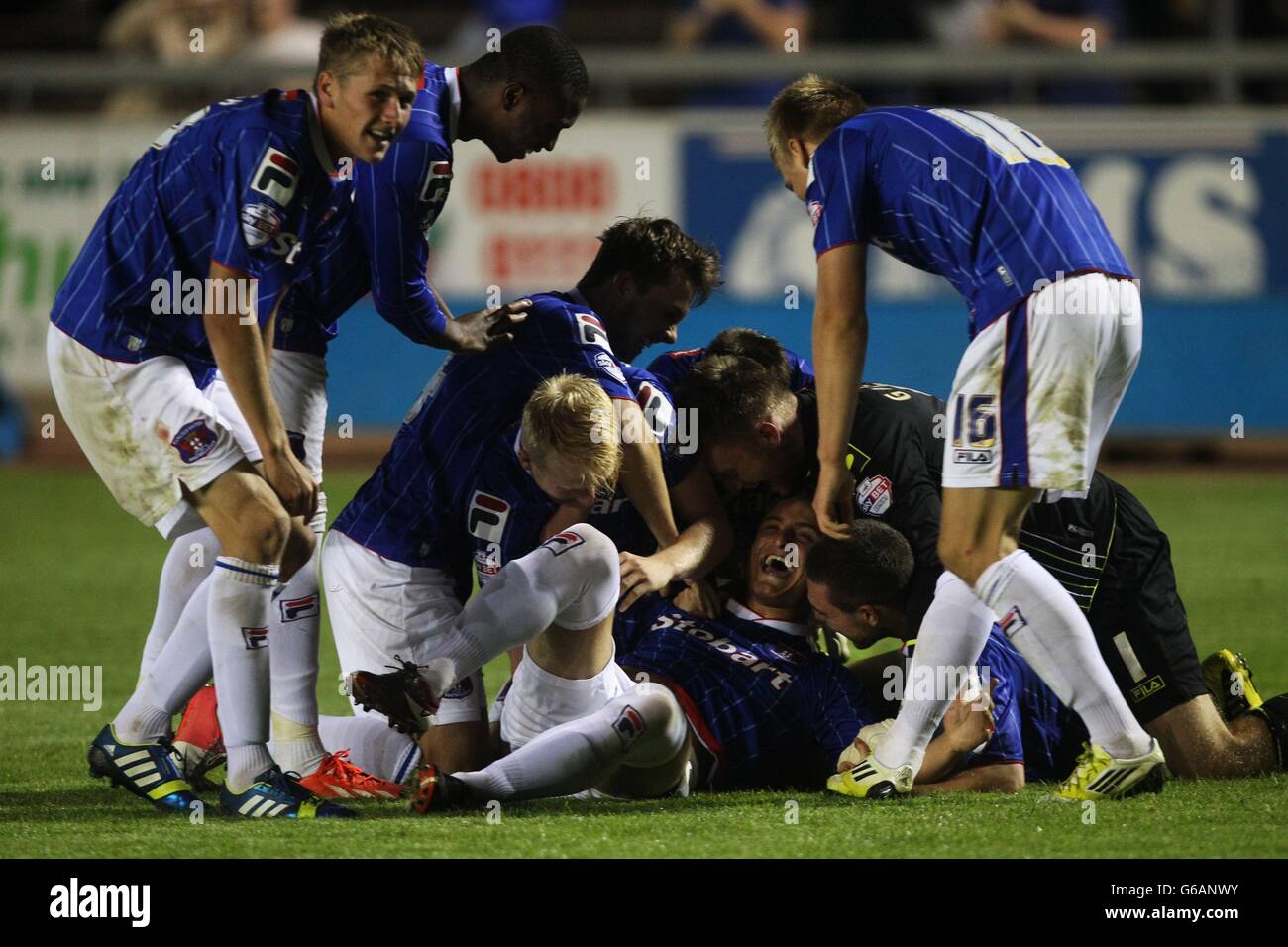 Carlisle United's David Symington (bottom centre) is congratulated by ...