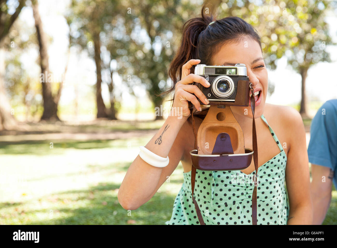 Woman taking picture, personal perspective Stock Photo - Alamy