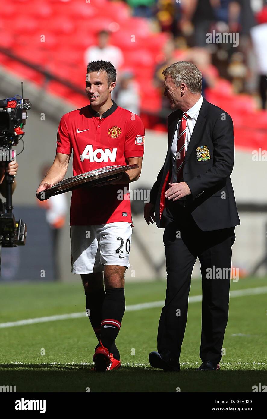 Manchester United manager David Moyes (right) walks around the pitch ...