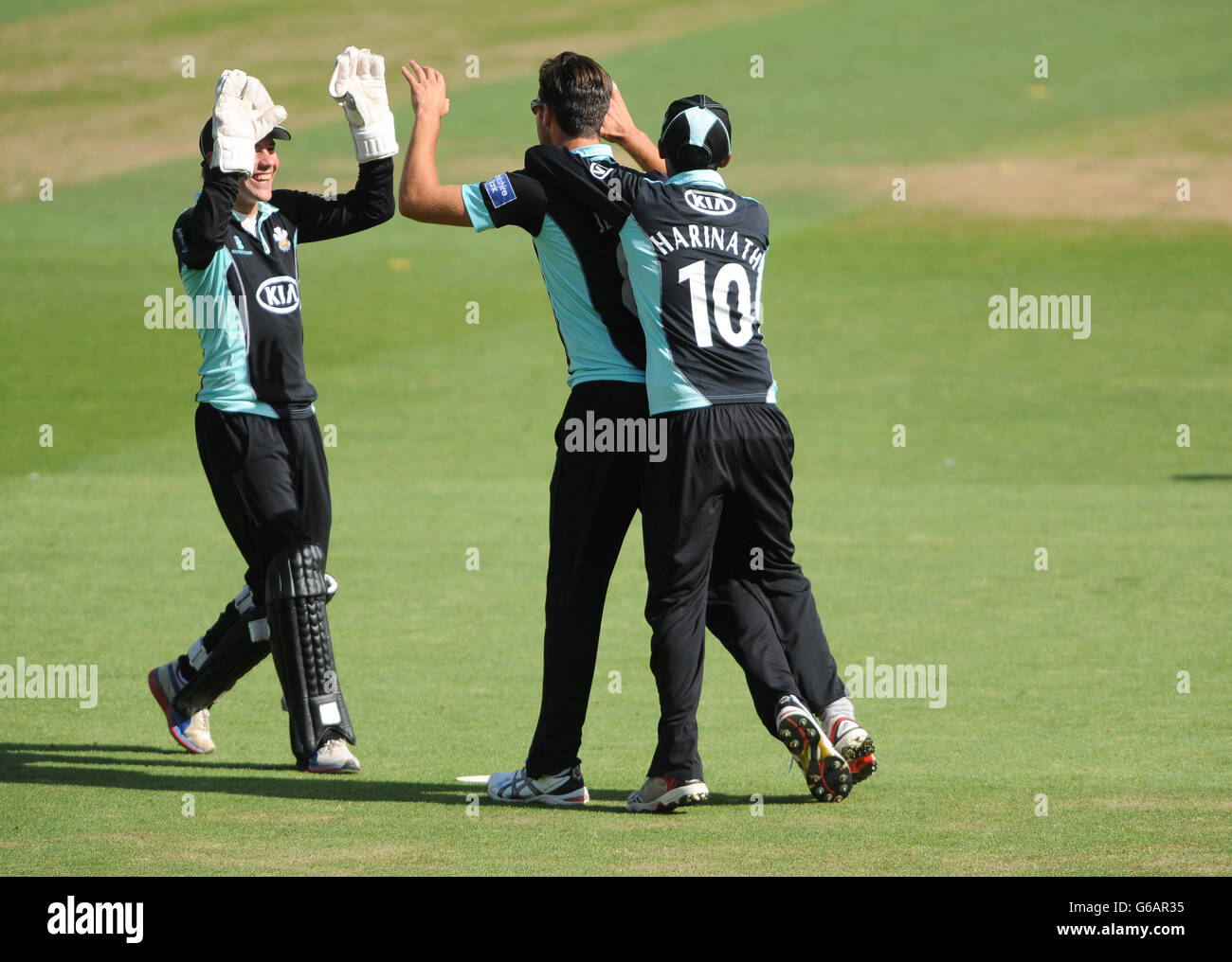 Surrey's Tom Jewell celebrates taking a spectacular catch to dismiss ...