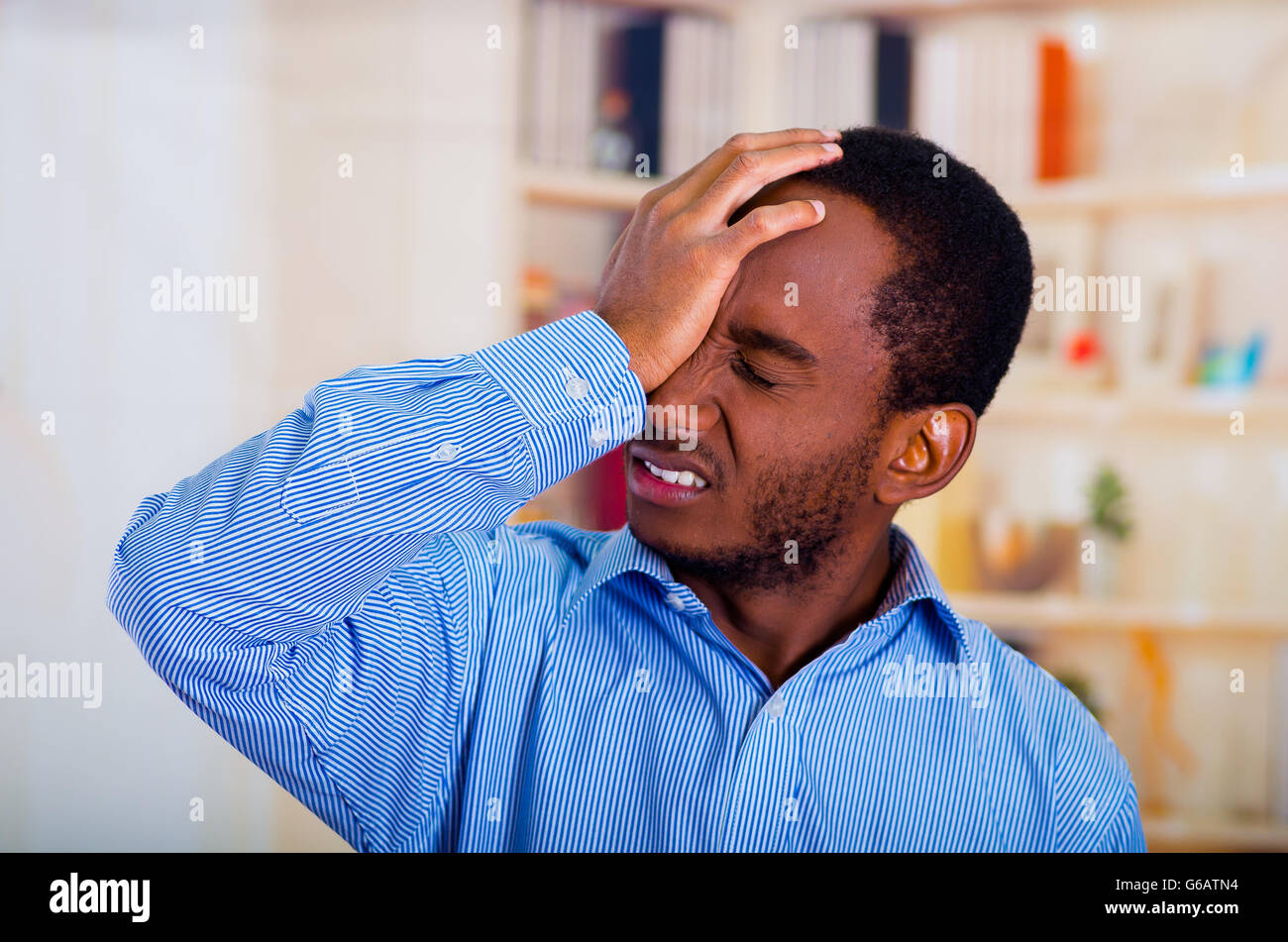Man touching his head with his hand, suffering face of pain Stock Photo ...
