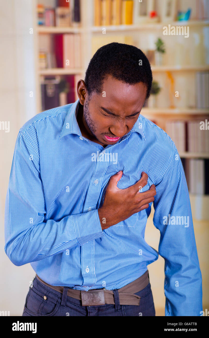 Man with pain face, heart attack in his chest. Hand holding his chest ...