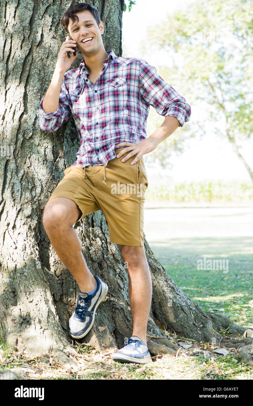 Man leaning against tree hi-res stock photography and images - Alamy