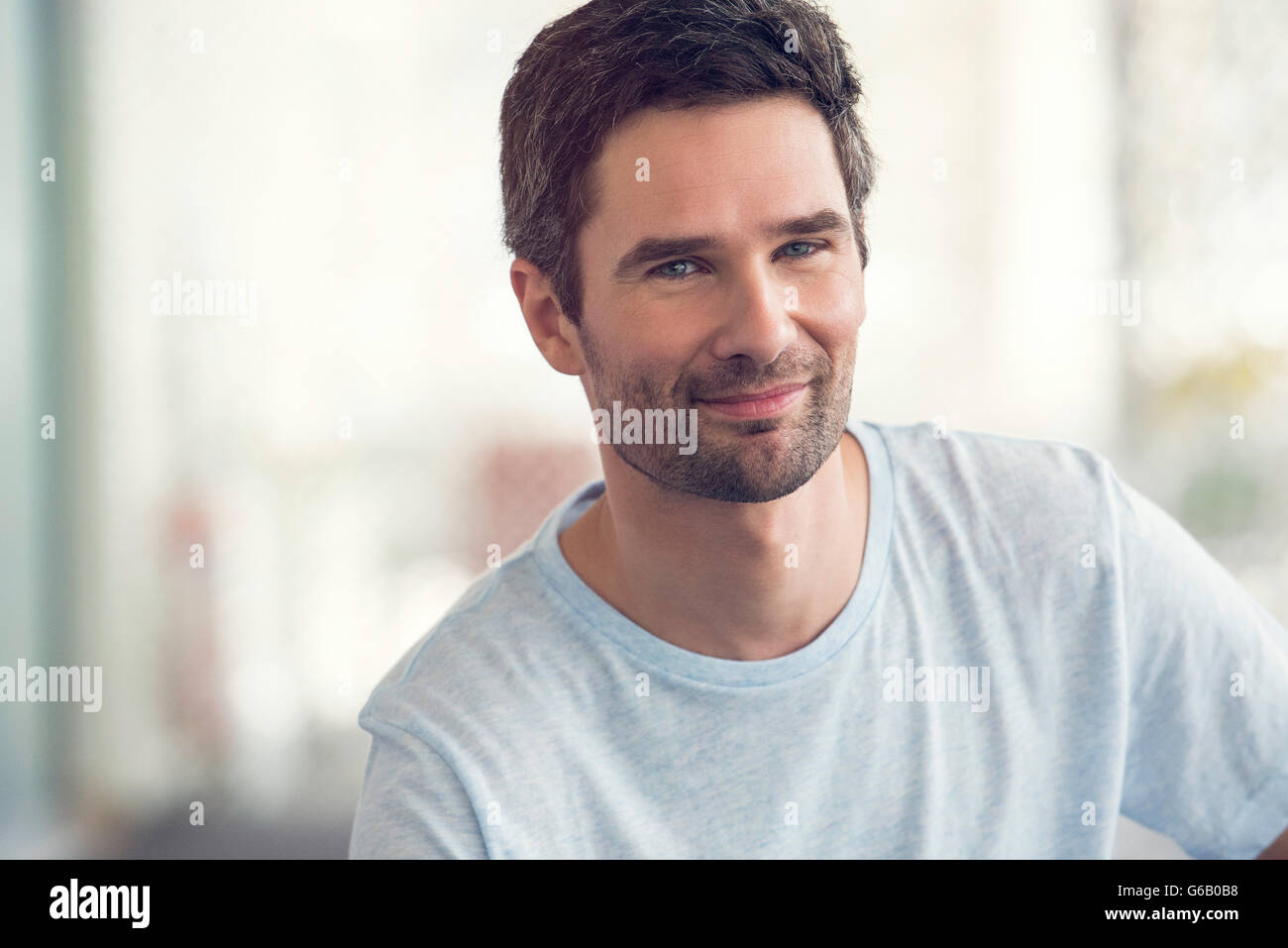 Handsome man age 35 smiling hi-res stock photography and images - Alamy