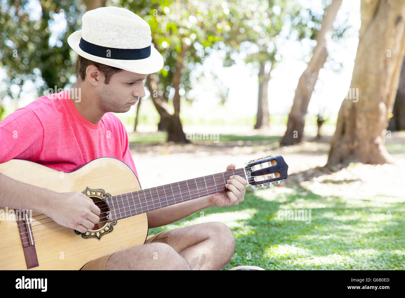 Young man practices guitar hi-res stock photography and images - Alamy