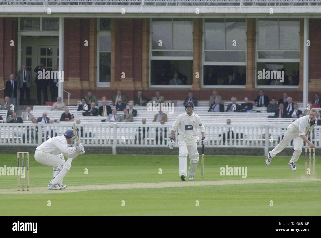 Lancashire batsman Stuart Law ducks beneath a delivery by Middlesex ...