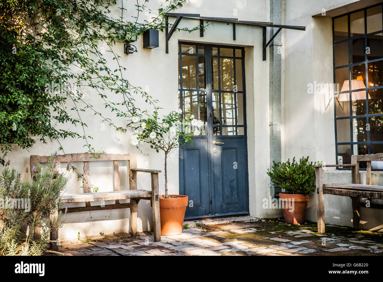 Wooden benches in residential courtyard Stock Photo - Alamy
