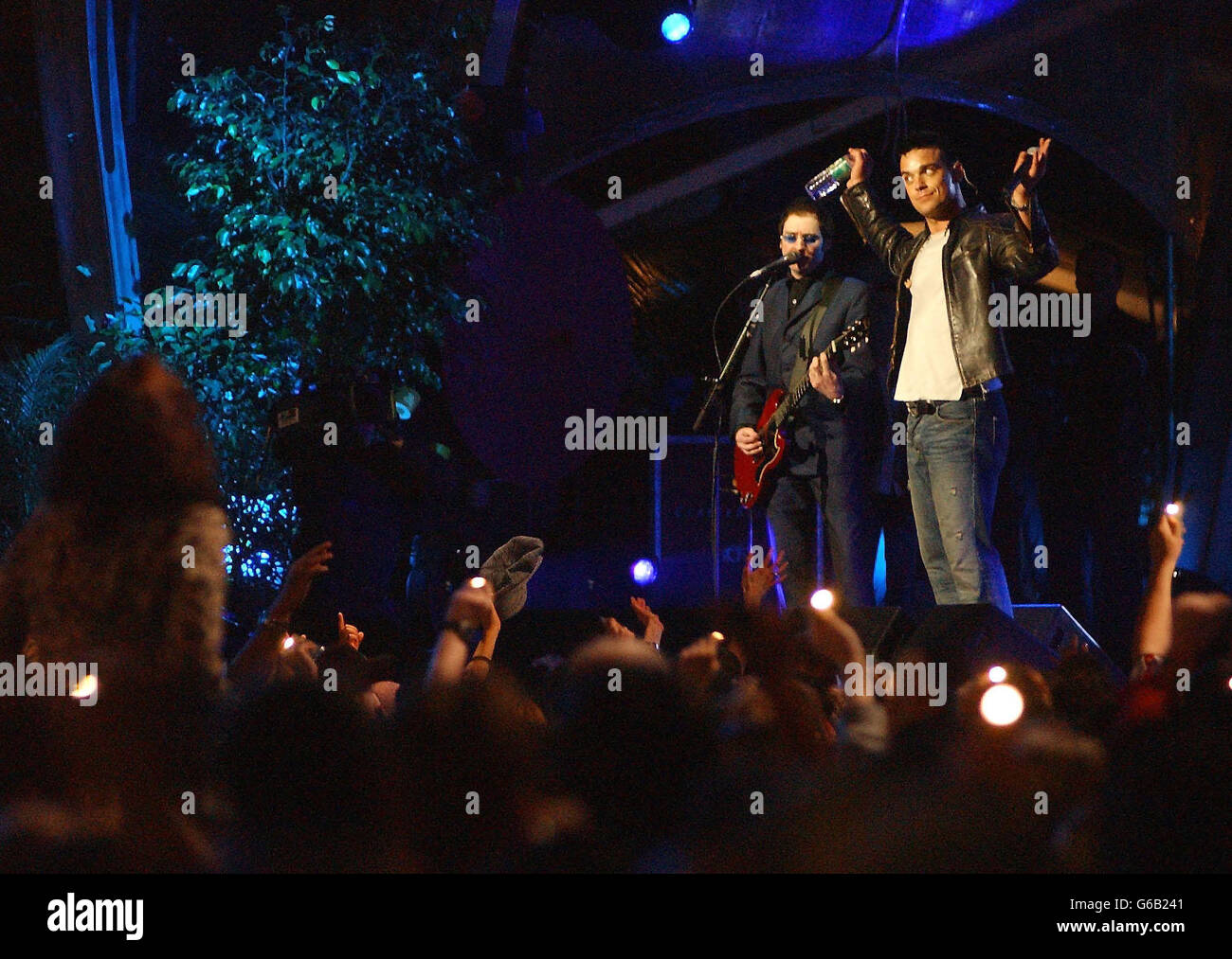 Robbie Williams performs on stage during 100% NYC, a concert ...