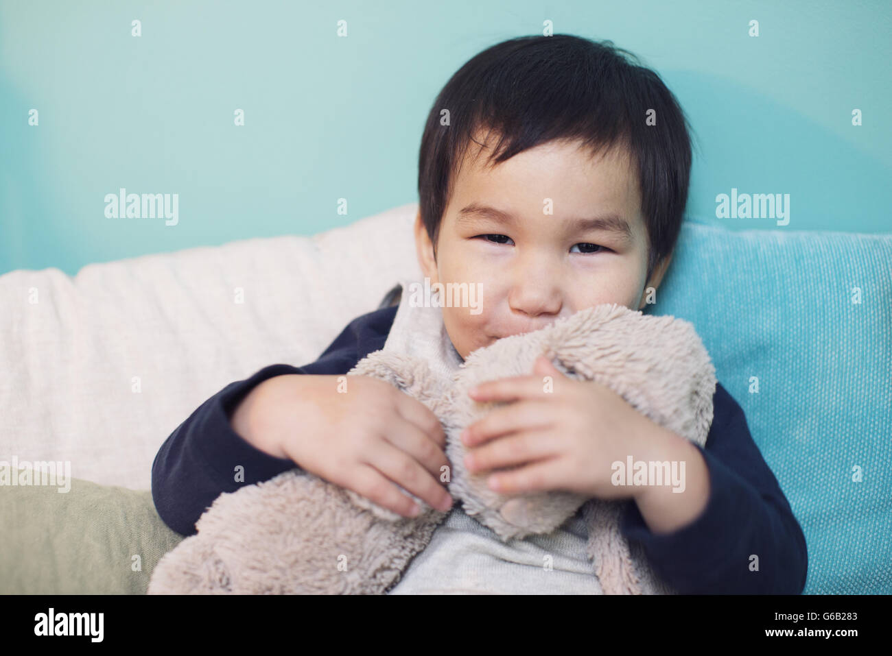 Little boy hugging stuffed toy rabbit Stock Photo - Alamy
