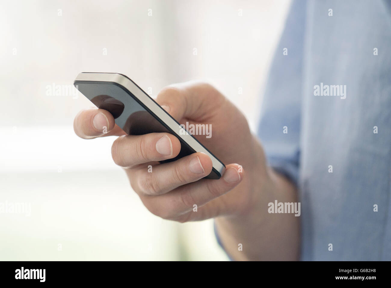 Using smartphone, close-up Stock Photo - Alamy
