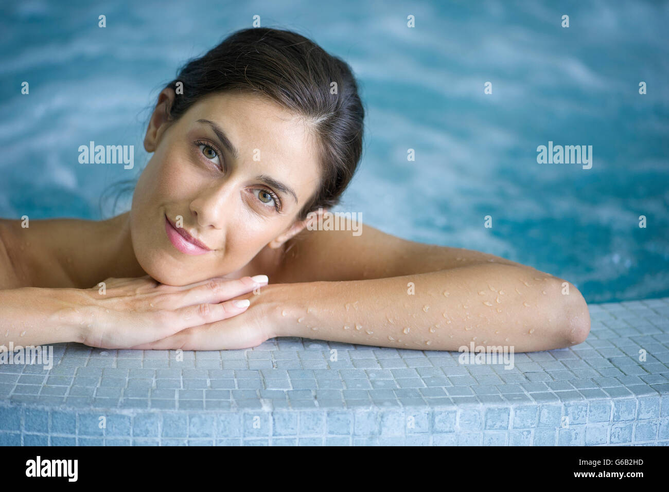 Woman relaxing in jacuzzi, portrait Stock Photo - Alamy