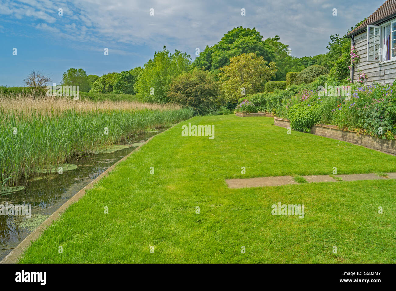 A view along stream at an English country cottage in Surrey Stock Photo ...