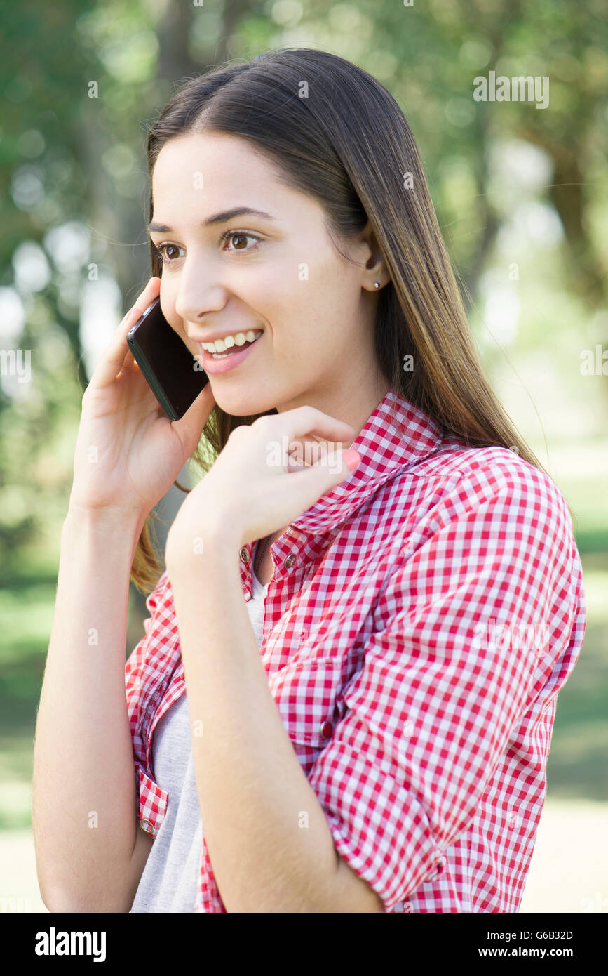 Woman receiving phone call with good news Stock Photo - Alamy