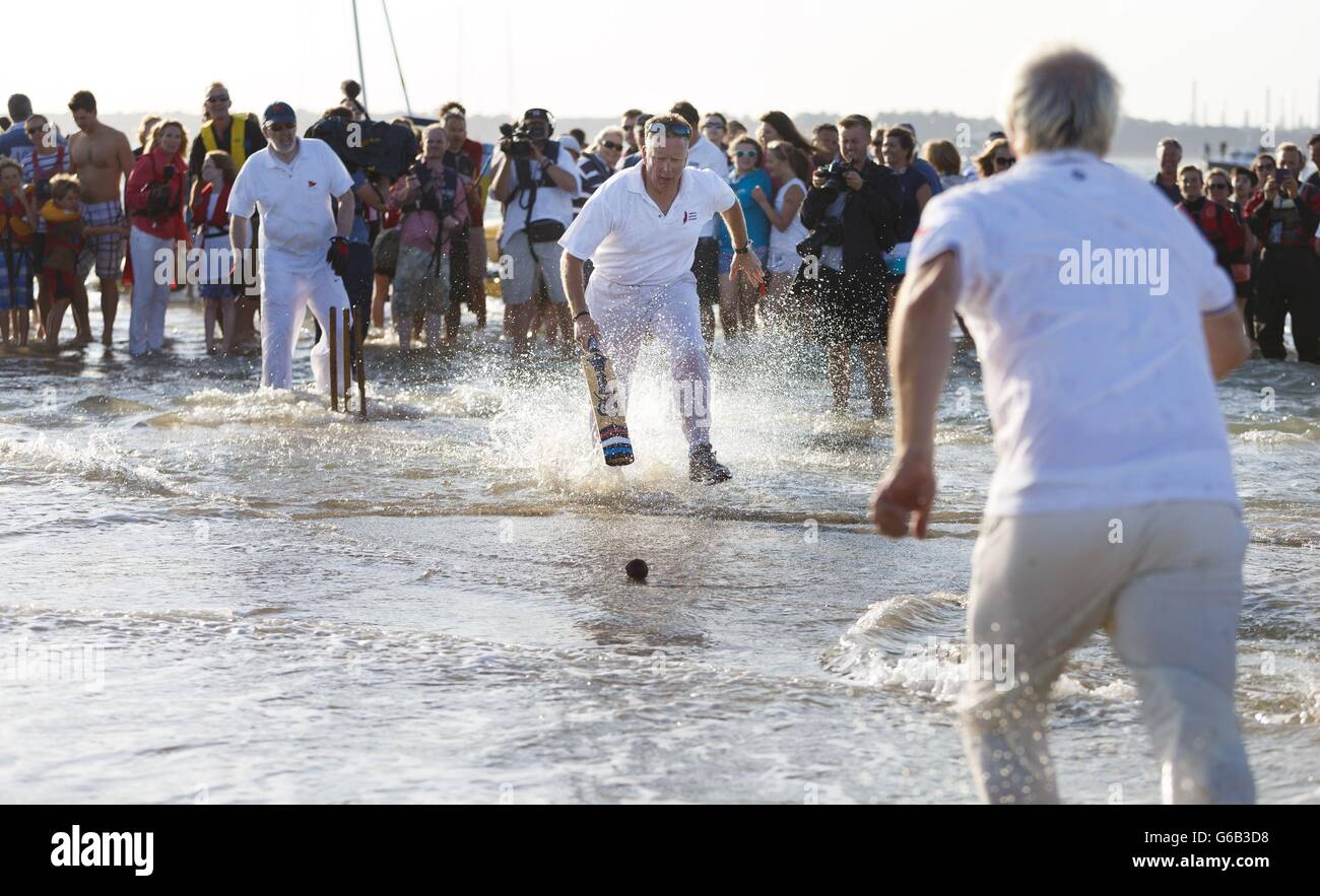 Annual Bramble Bank cricket match in the sea Stock Photo - Alamy
