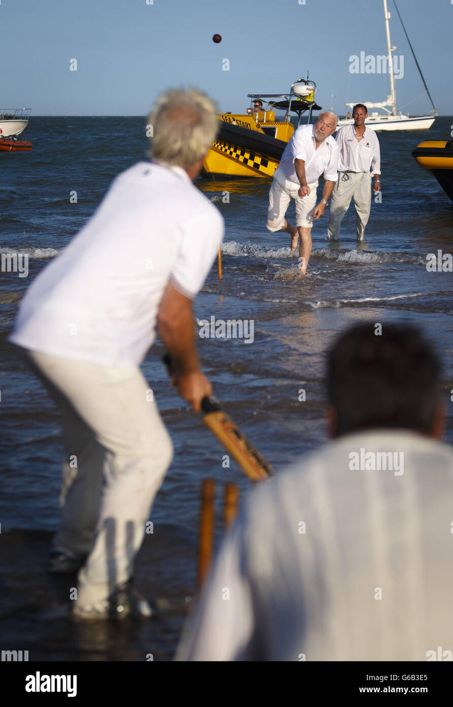 Sir Robin Knox-Johnston bowls during the annual Bramble Bank cricket ...