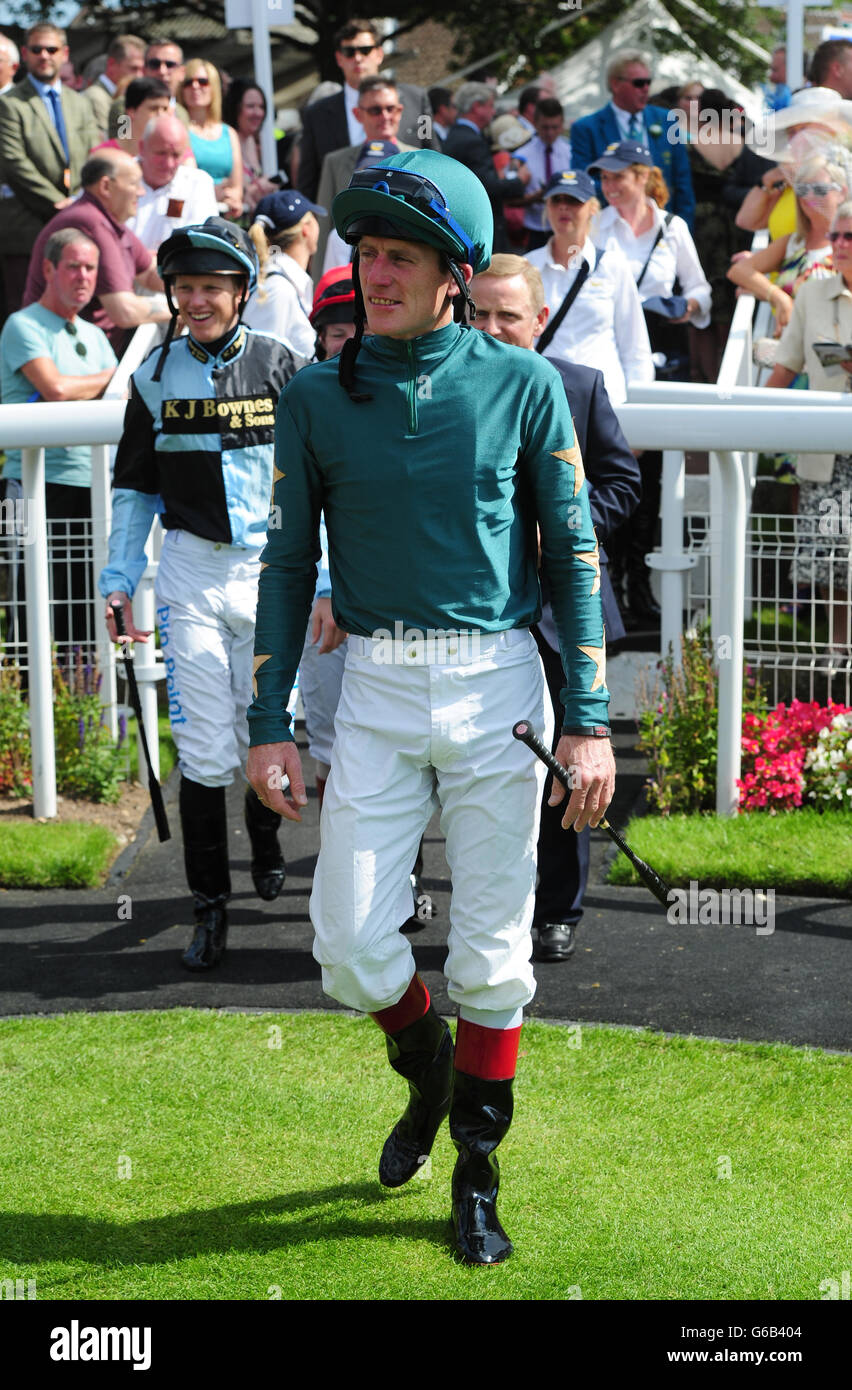 Jockey Johnny Murtagh arrives in the parade ring during day two of the ...