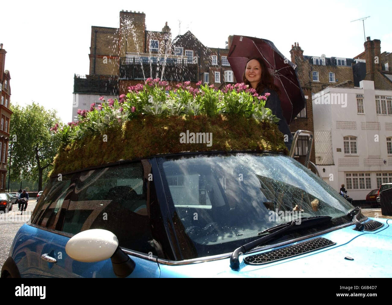 Shona Martin, aged 24 from Leeds, next to a Mini Cooper 'S' cars with ...