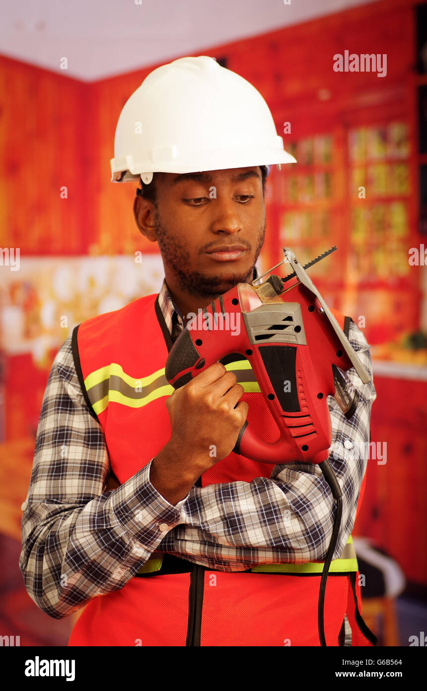 Young engineer carpenter wearing square pattern flanel shirt with red ...