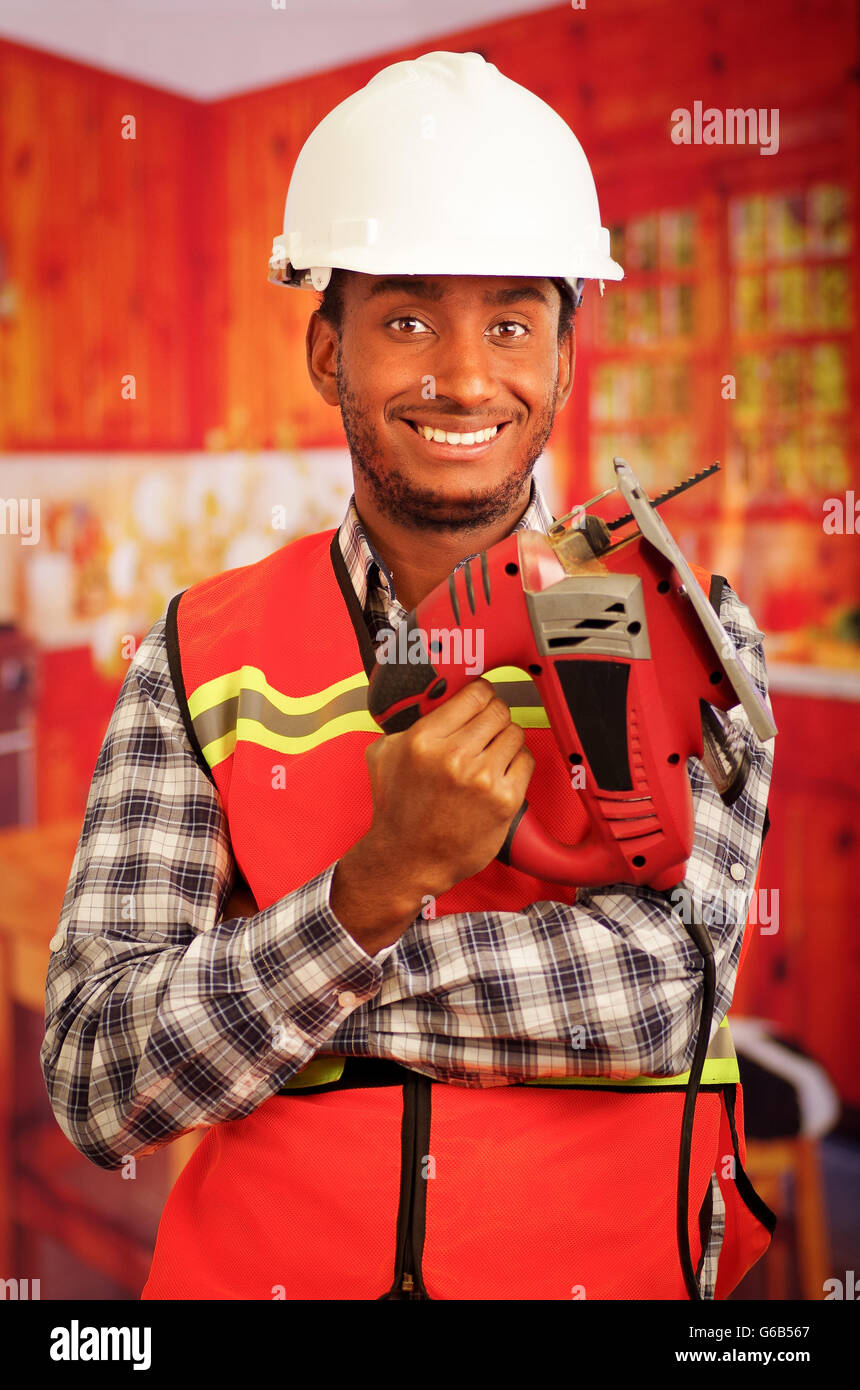 Young engineer carpenter wearing square pattern flanel shirt with red ...