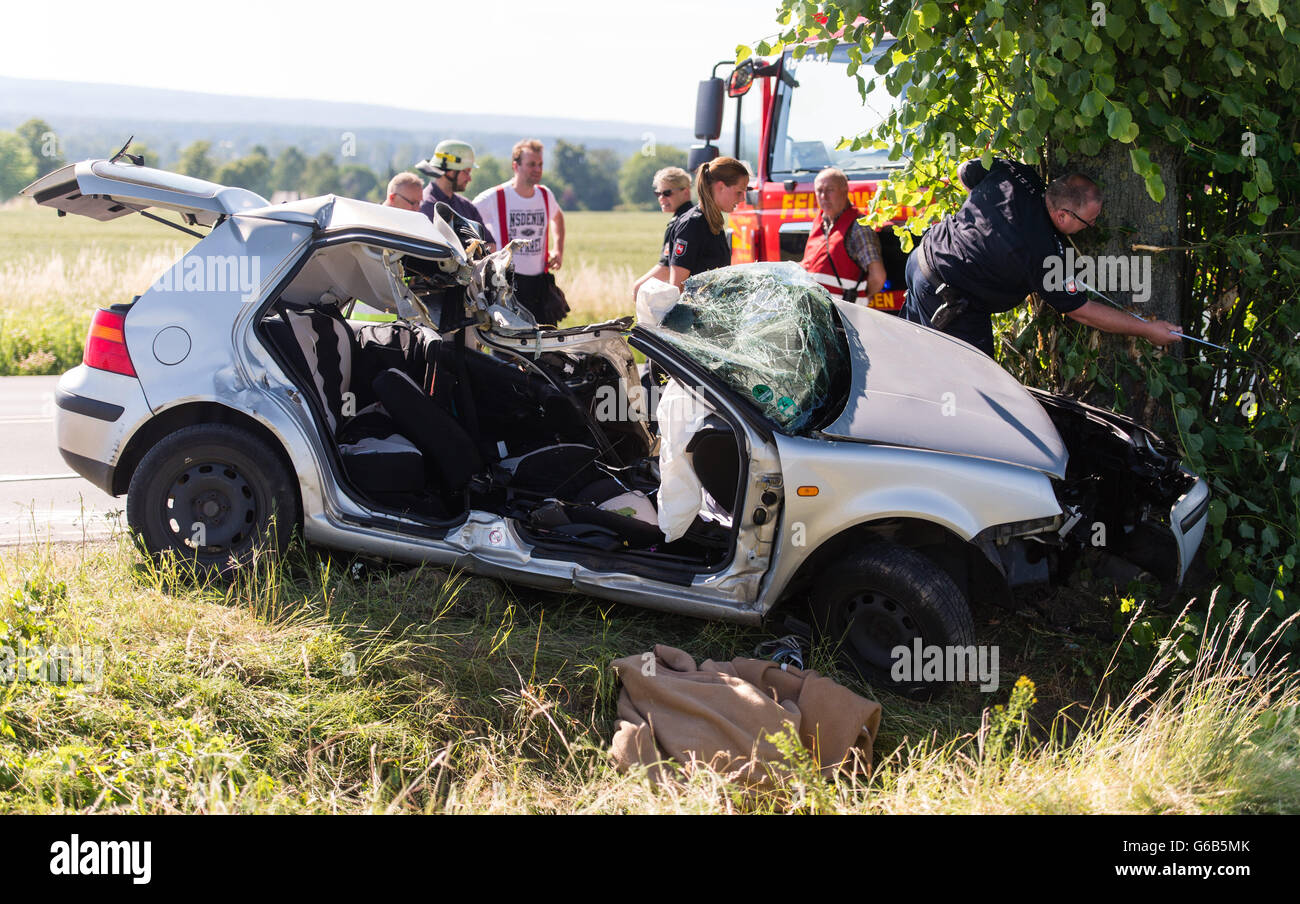 Police and rescue services standing next to a crashed VW Golf, on the ...