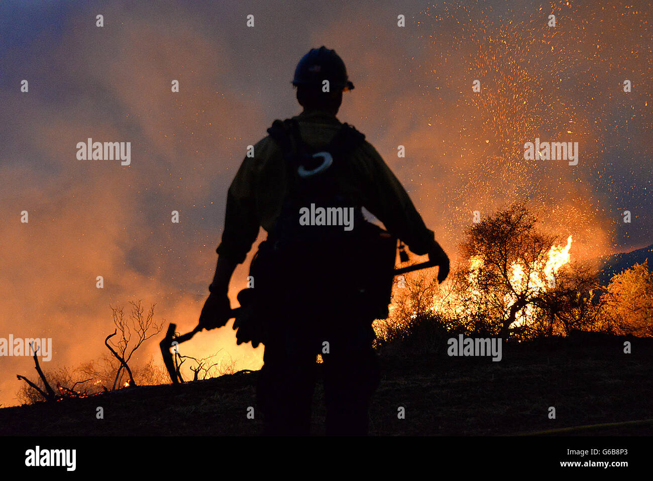 June 17, 2016 - A US Forest Service Hot Shot crew member prepares to go ...