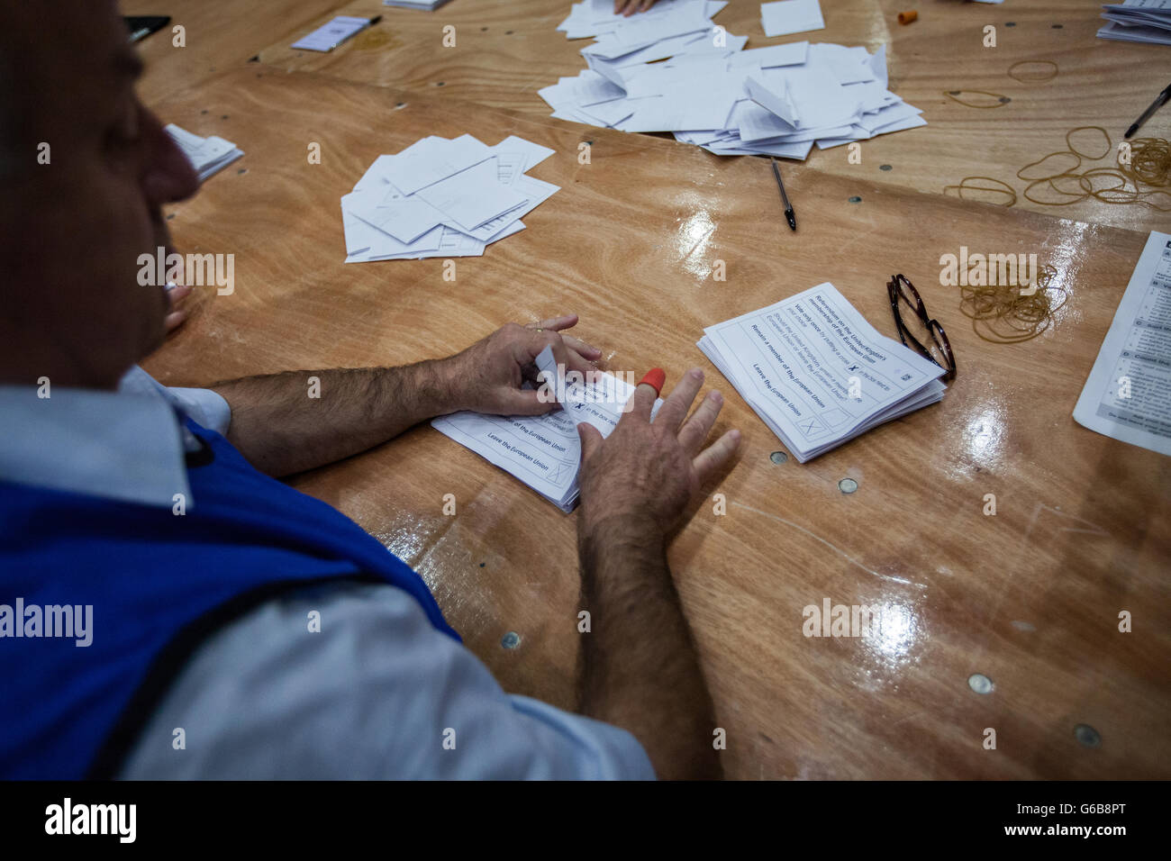Belfast, UK. 23rd June, 2016. person counting ballot papers at the ...