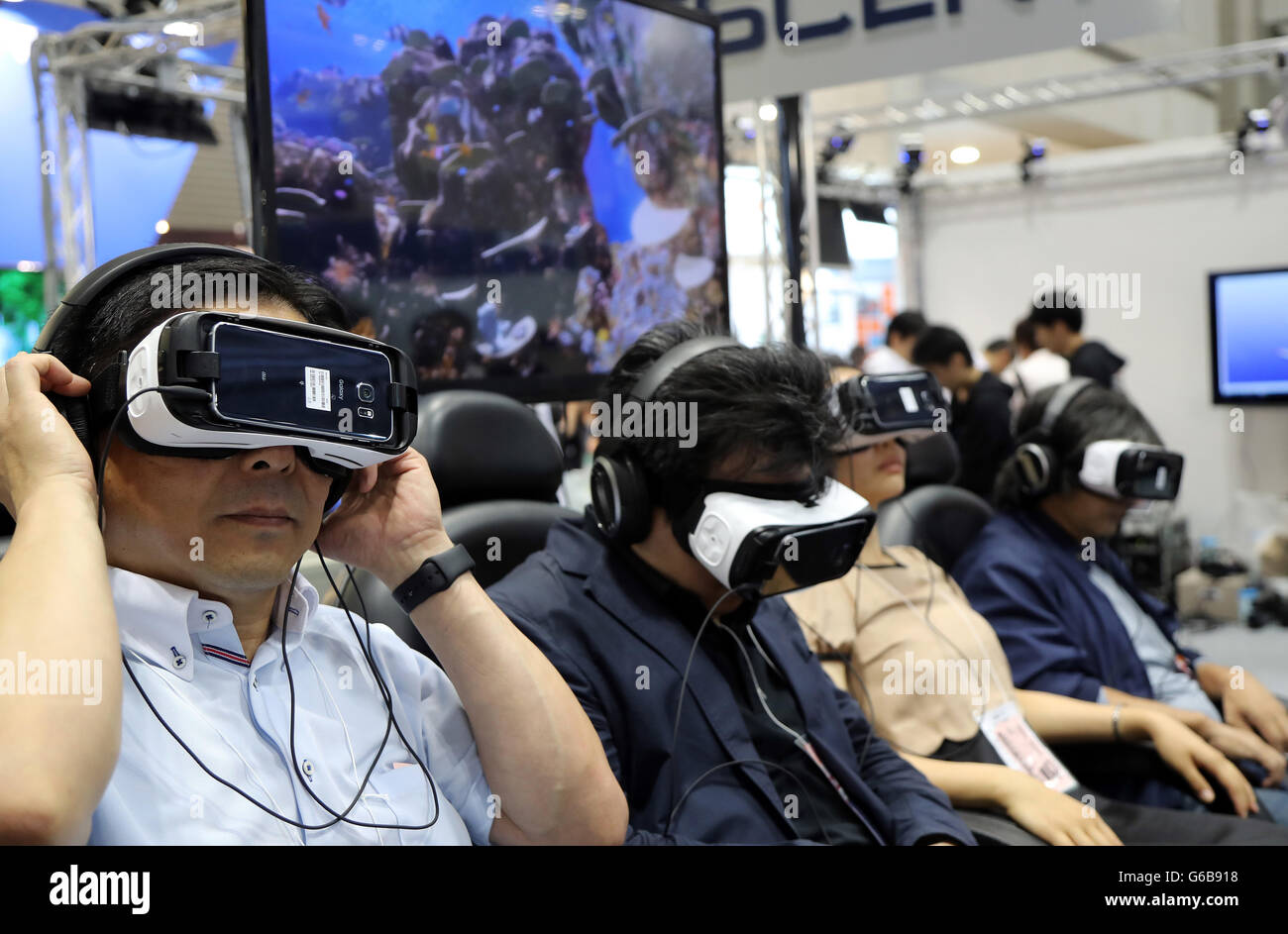 Tokyo, Japan. 23rd June, 2016. Visitors enjoy virtual undersea ...