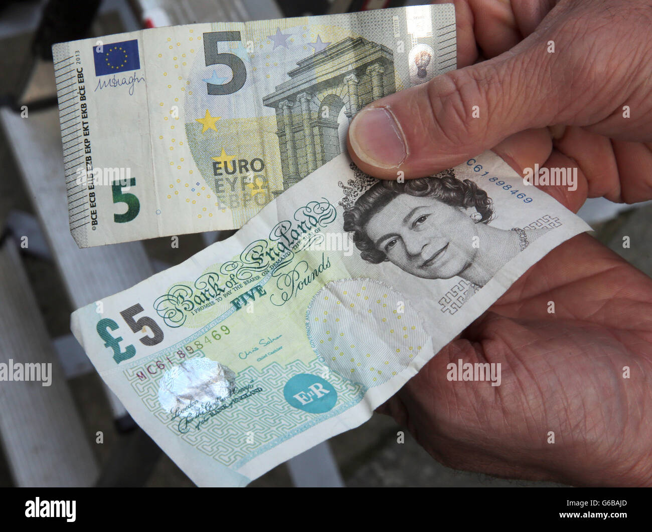 London, Britain. 24th June, 2016. A 5-pound (bottom) and a 5-euro bill ...