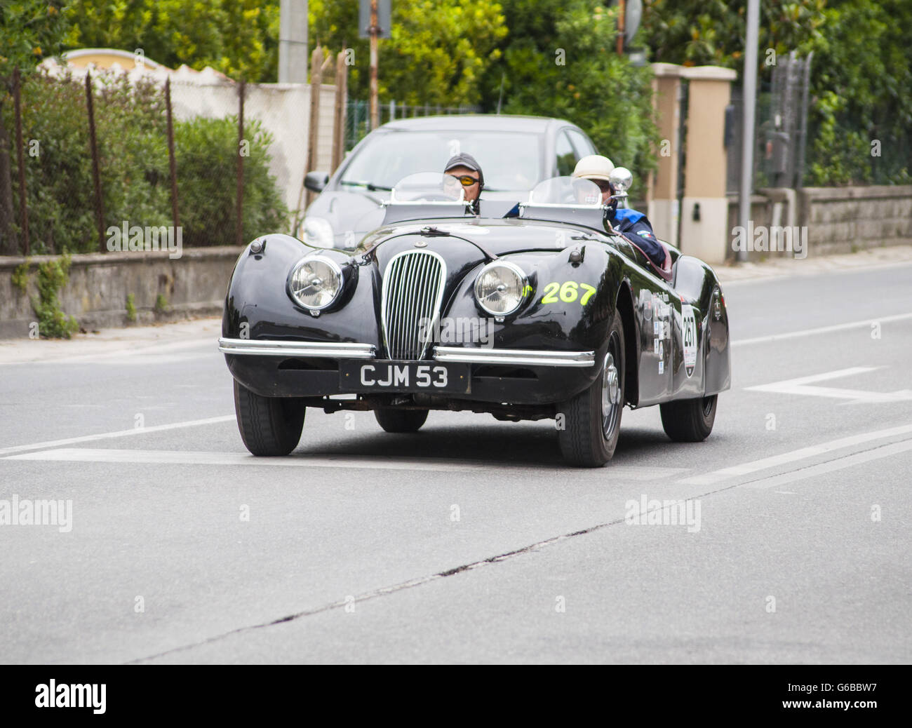 FANO, ITALY - MAY 16: Jaguar XK 120 OTS old racing car in rally Mille ...