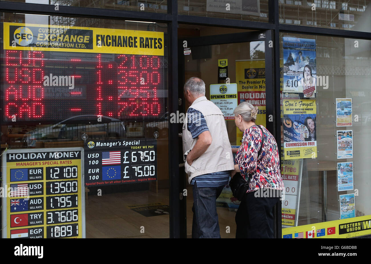 London, Britain. 24th June, 2016. Customers enter a currency exchange ...