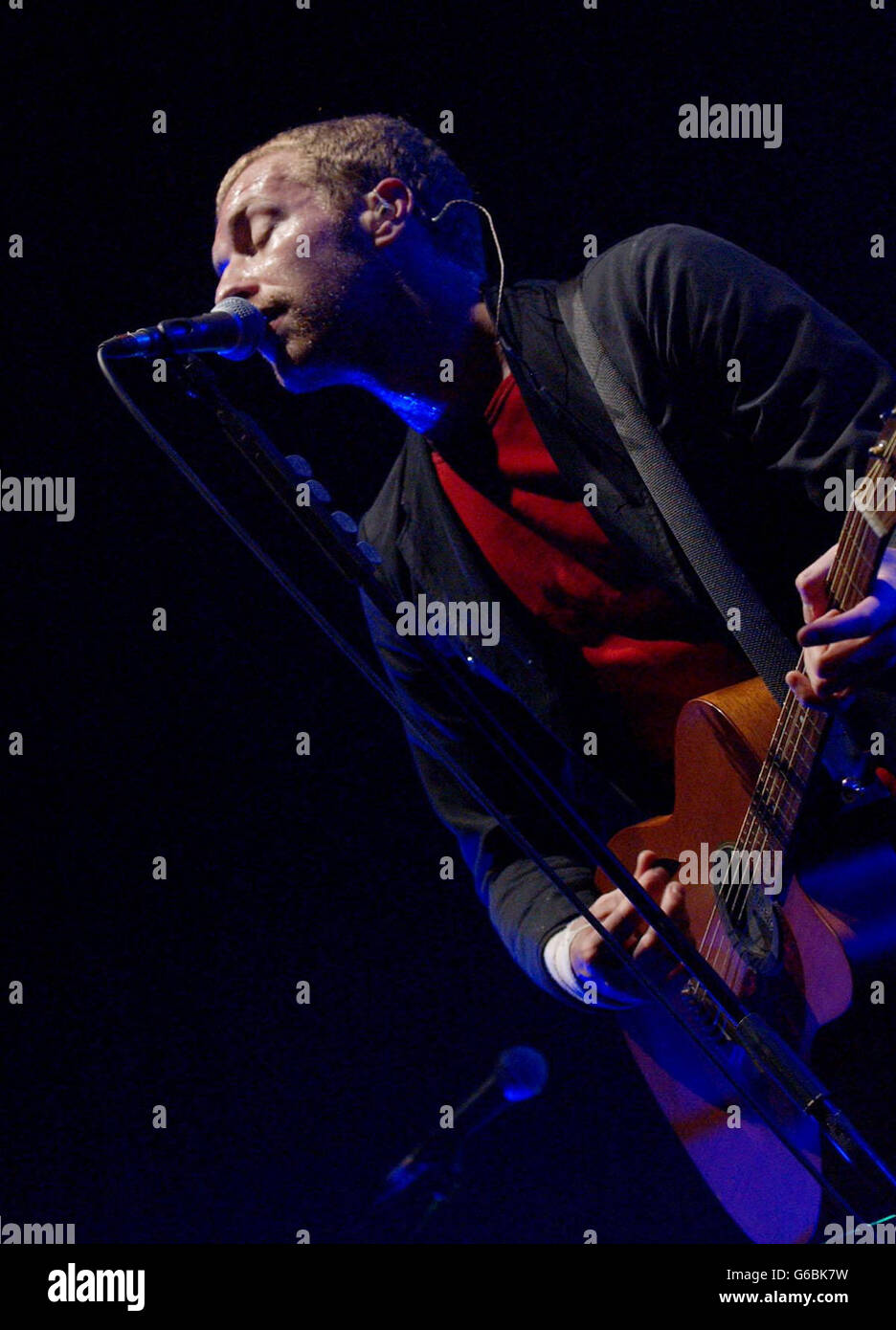 Chris Martin, lead singer of rock band Coldplay performing live at ...