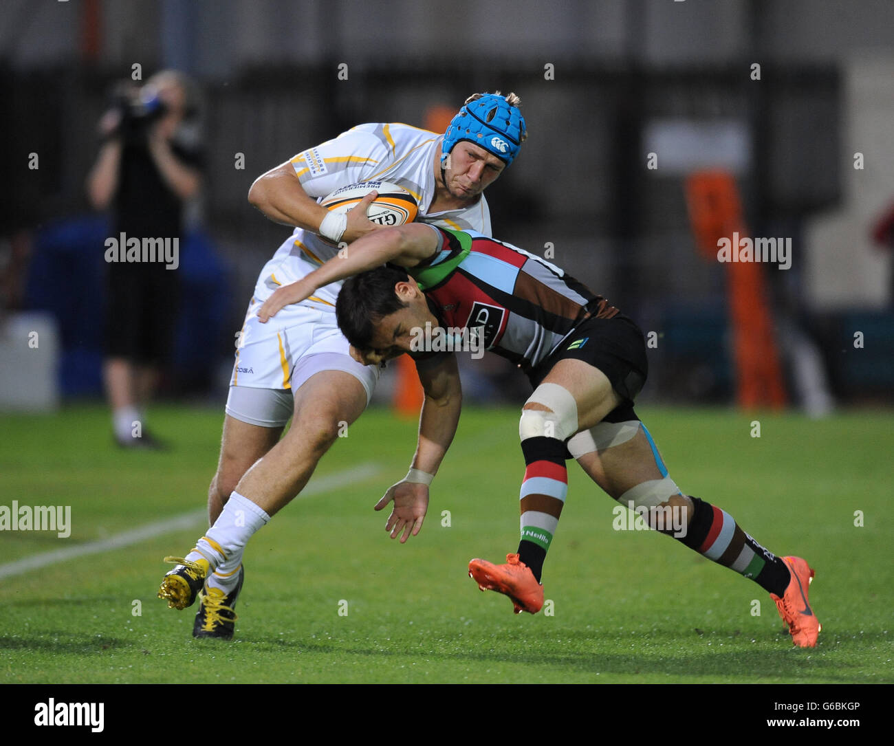 Worcester Warriors' Richard De Carpentier is tackled by Harlequins ...