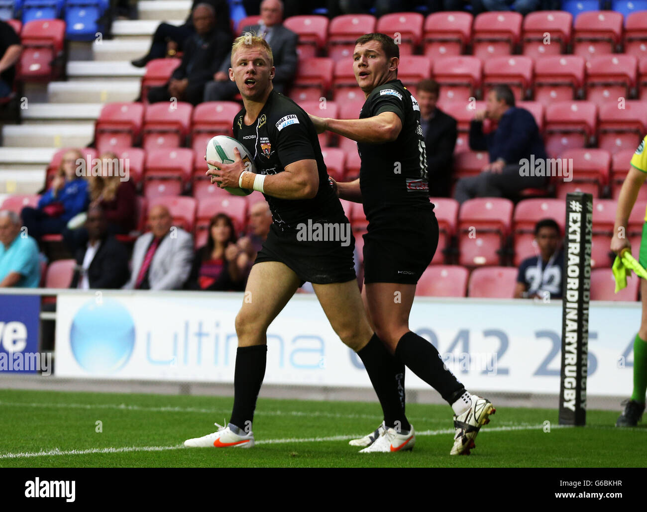 Huddersfield's Aaron Murphy (left) celebrates a try during the Super ...