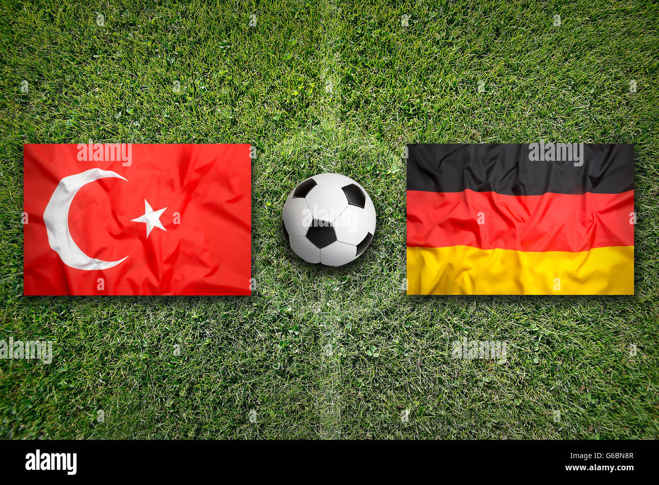 Turkey vs. Germany flags on green soccer field Stock Photo - Alamy